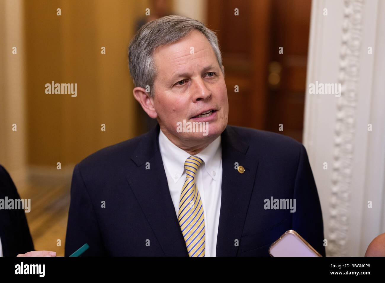 Senator Steve Daines (R-MO) speaks with members of the media outside ...