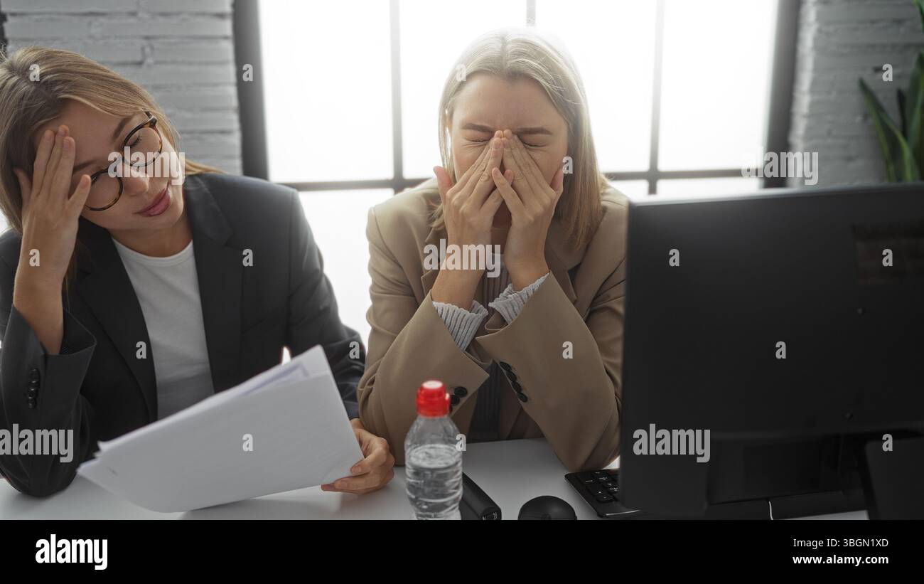 Women executives appear stressed in a modern office, highlighting ...