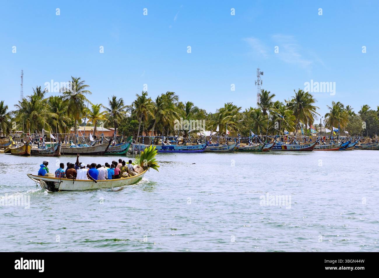 Fishing village Ada Foah with painted fishing boats on the banks of the ...