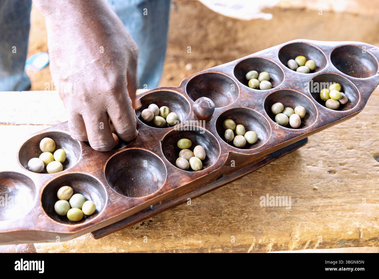 Board game Awale with the carvers of Ahwiaa north of Kumasi in the ...