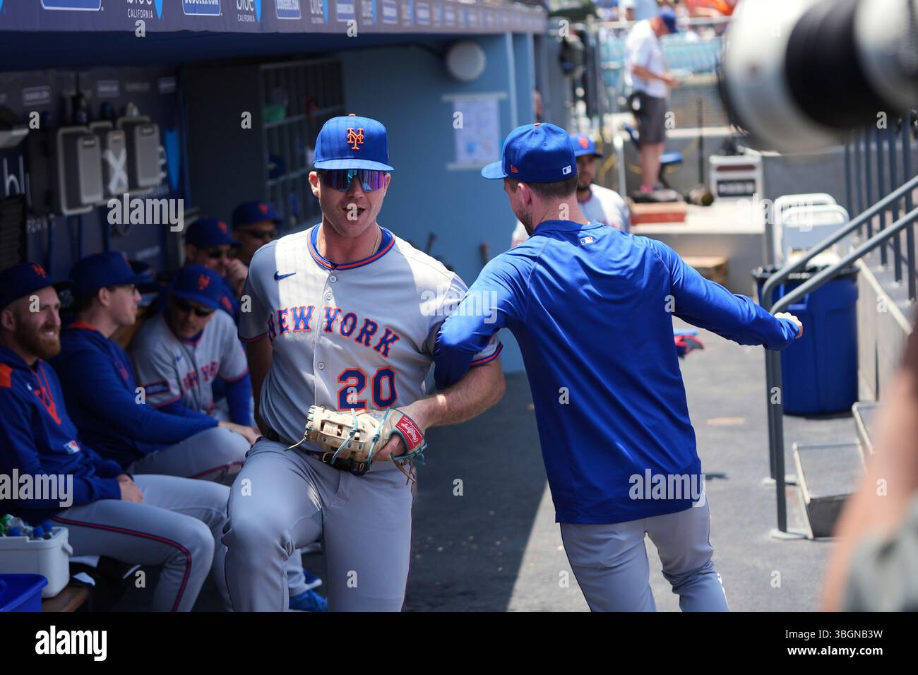 New York Mets' Pete Alonso (20) jokes around with a teammate before the ...
