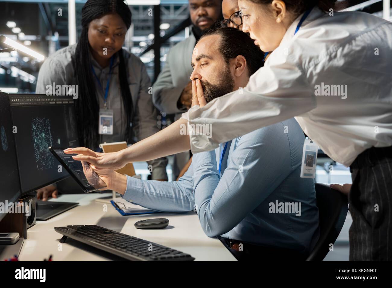 Data center admins working together hi-res stock photography and images ...