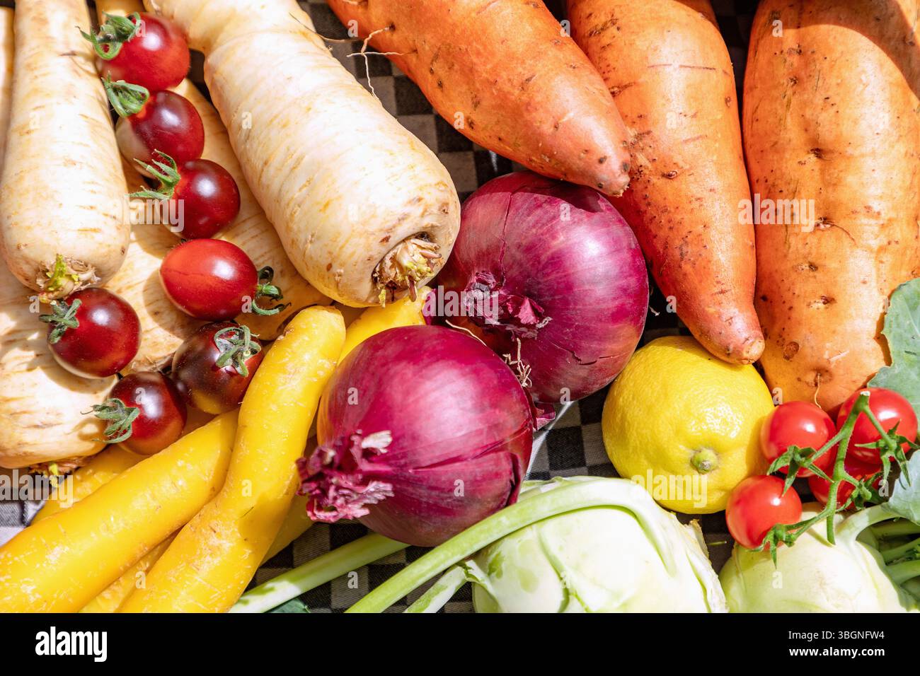 Vegetable and fruit tray with parsnips, cocktail tomatoes, red onions ...