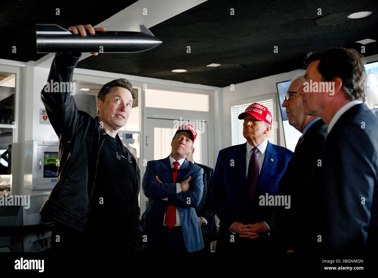 FILE - President-elect Donald Trump listens as Elon Musk explains the ...