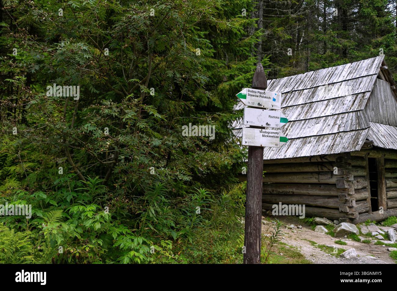 Signpost on the hiking trail to the Valley of the Five Polish Ponds ...