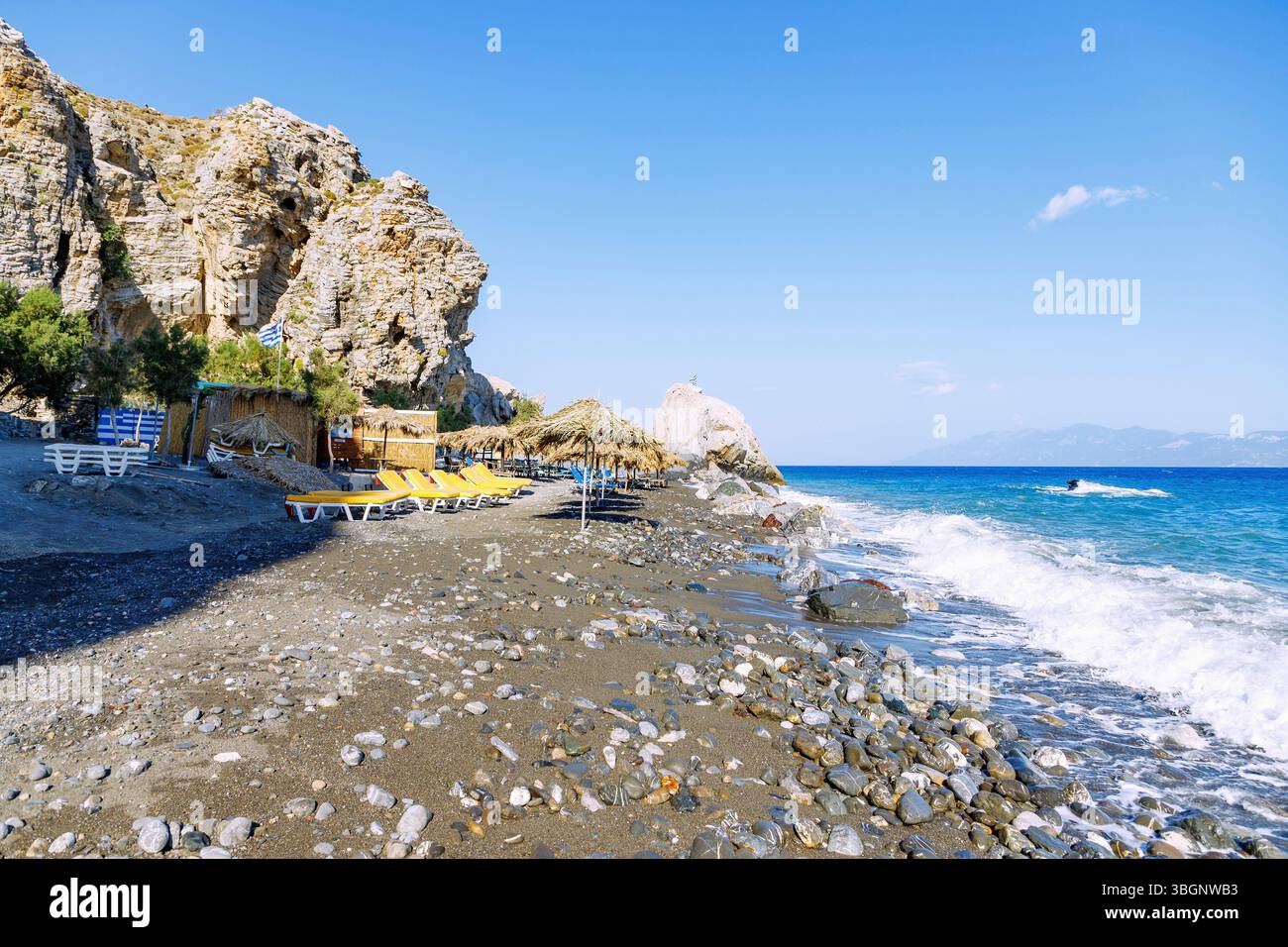 Sand and pebble beach Embros Thermes Beach on the island of Kos in ...