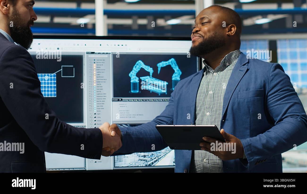 Solar panel factory manager shaking hands with investor interested in ...