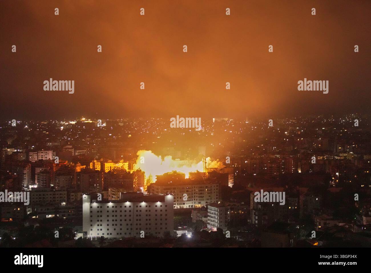 Flames rise following an Israeli airstrike on Dahiyeh in the southern ...