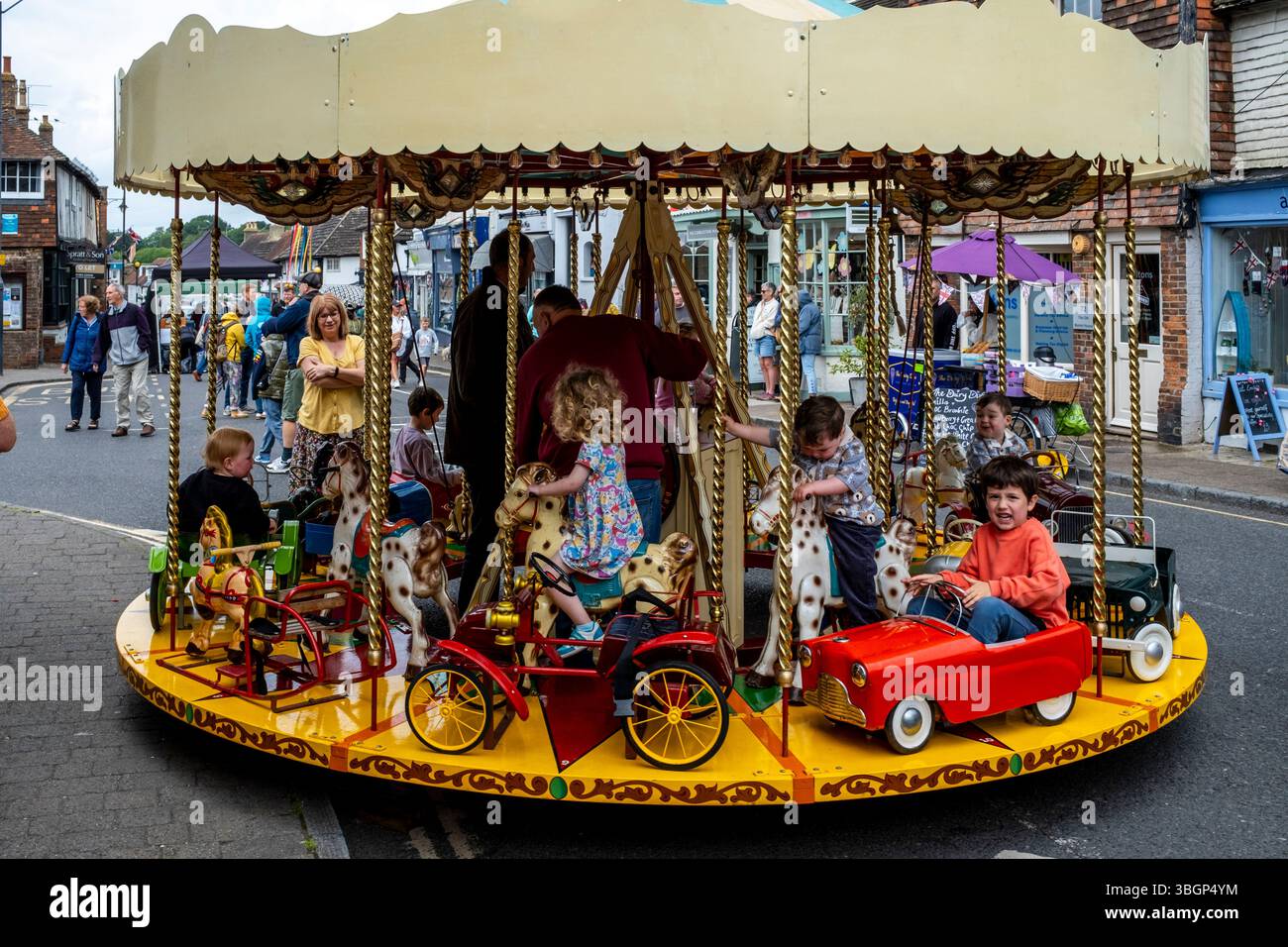 Local Children Riding On A Traditional Carousel At The Steyning Country ...