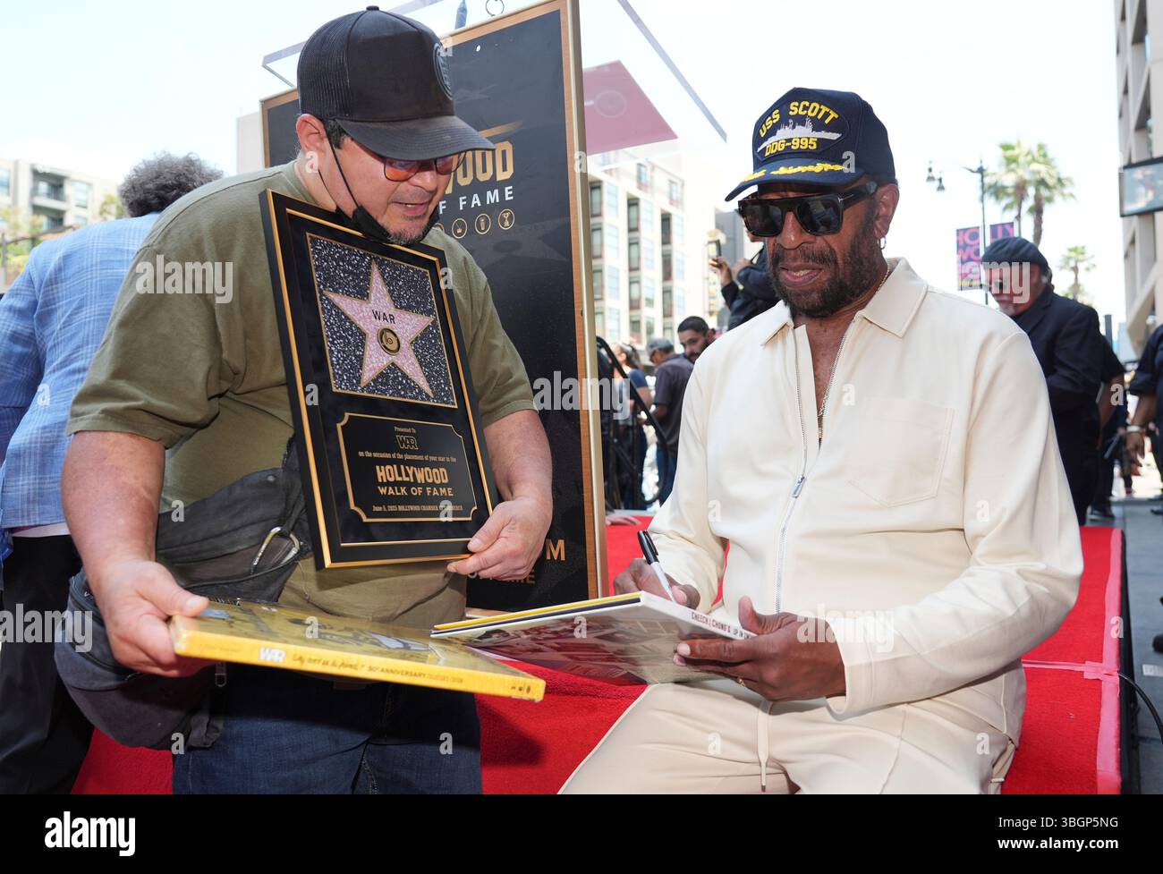 WAR founding member Howard Scott, right, signs albums for longtime WAR ...