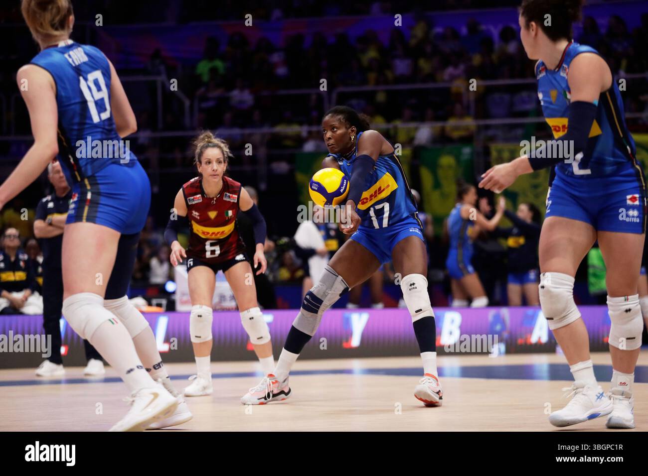 Italy's Myriam Fatime Sylla, center, bumps a ball against Germany ...