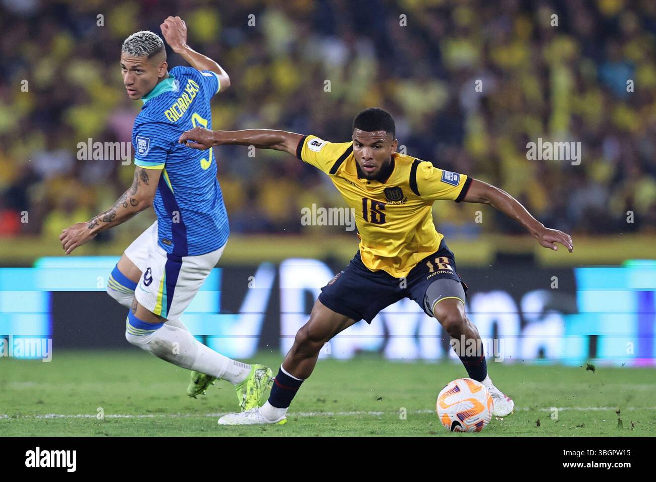 Ecuador's Alan Minda, right, and Brazil's Richarlison battle for the ...