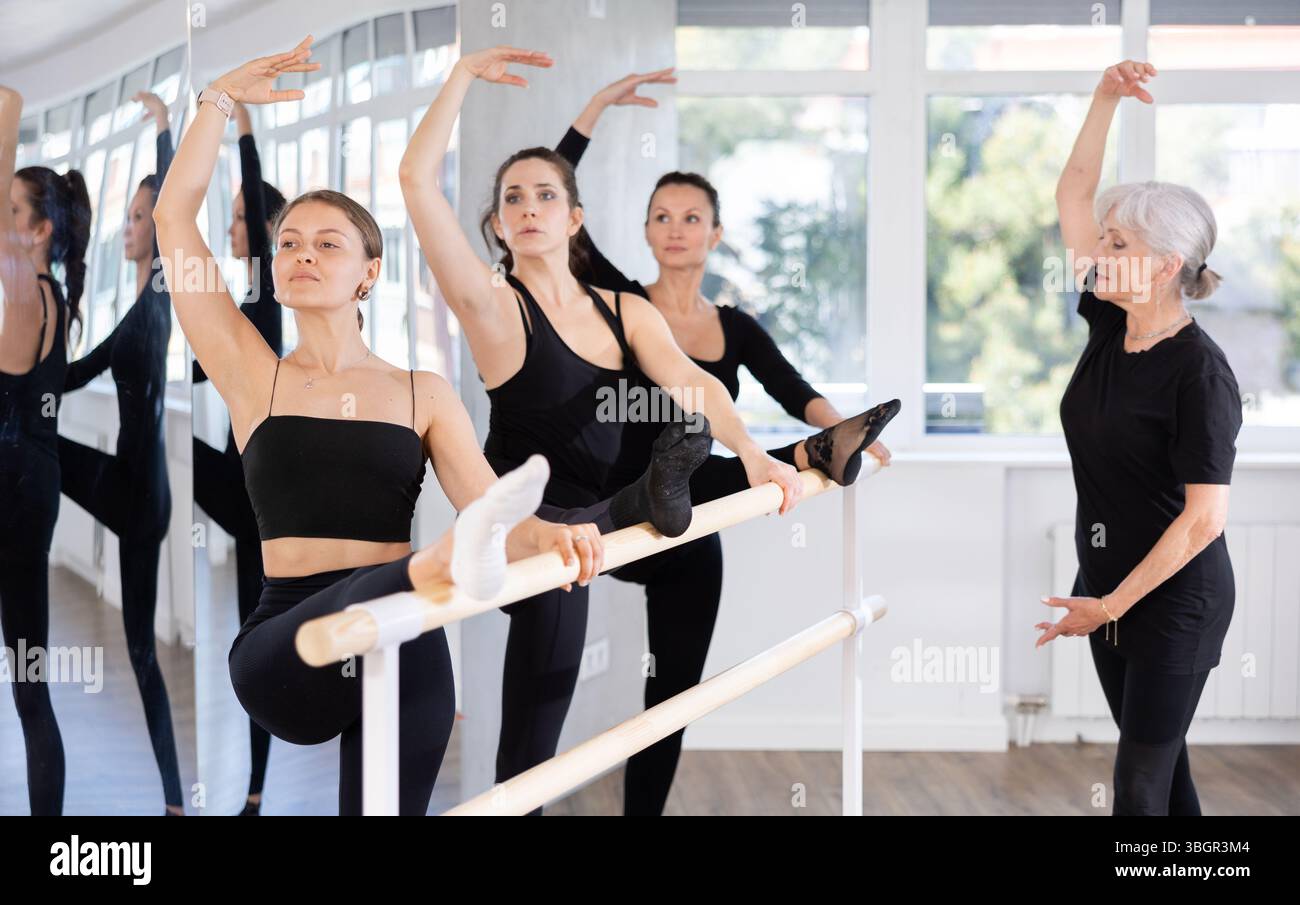Students Of Dance Studio Perform Exercises Under Supervision Of Mature