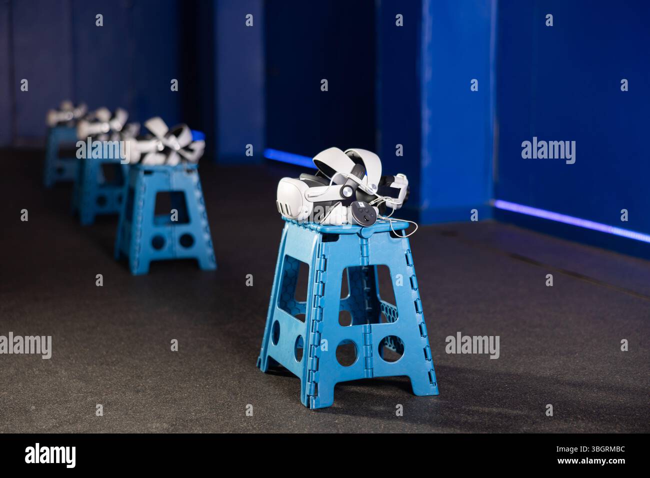 VR headsets and controllers in virtual reality gaming room Stock Photo ...