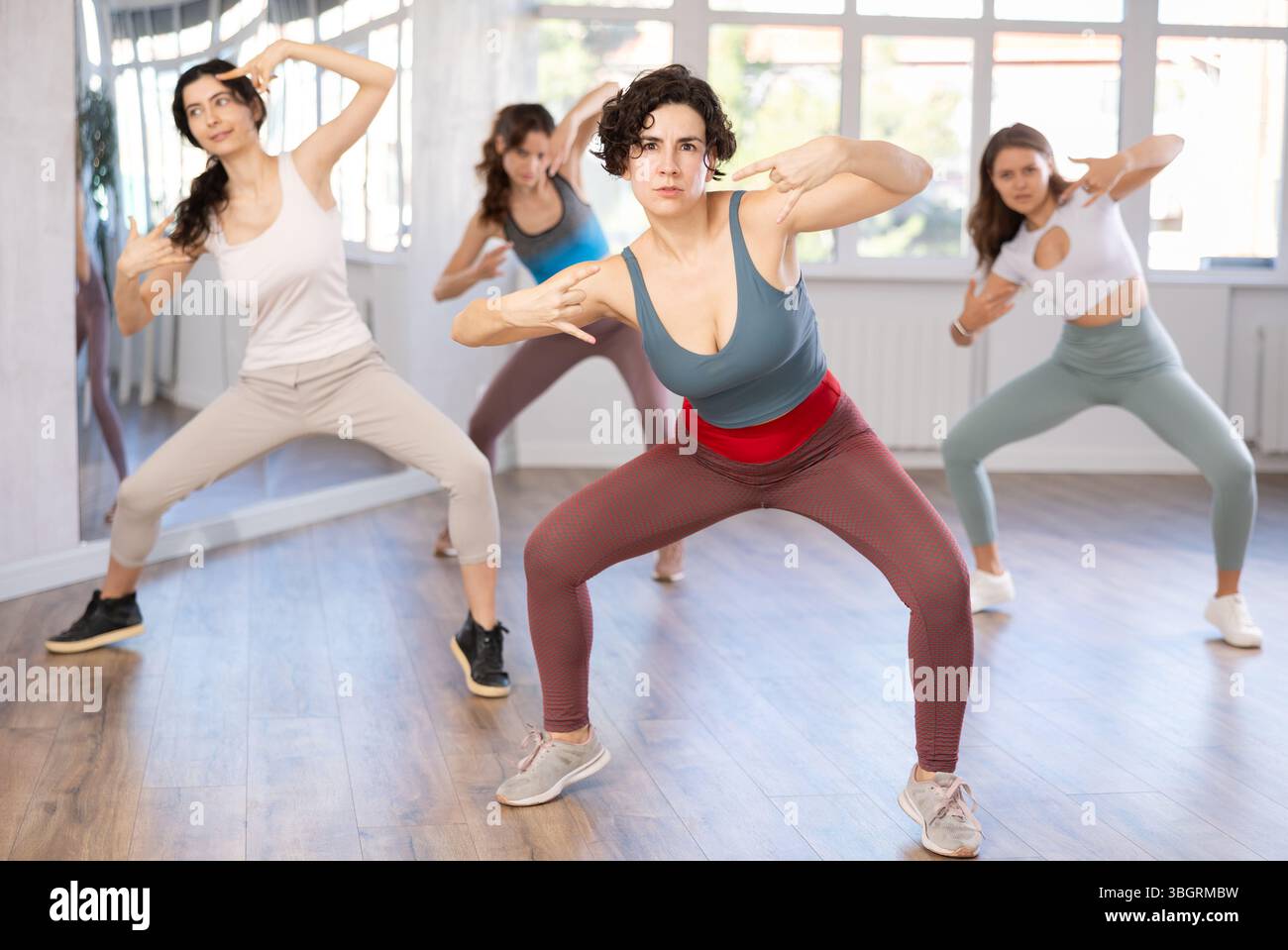 Female teacher conducts modern dance lessons for group of girls Stock ...