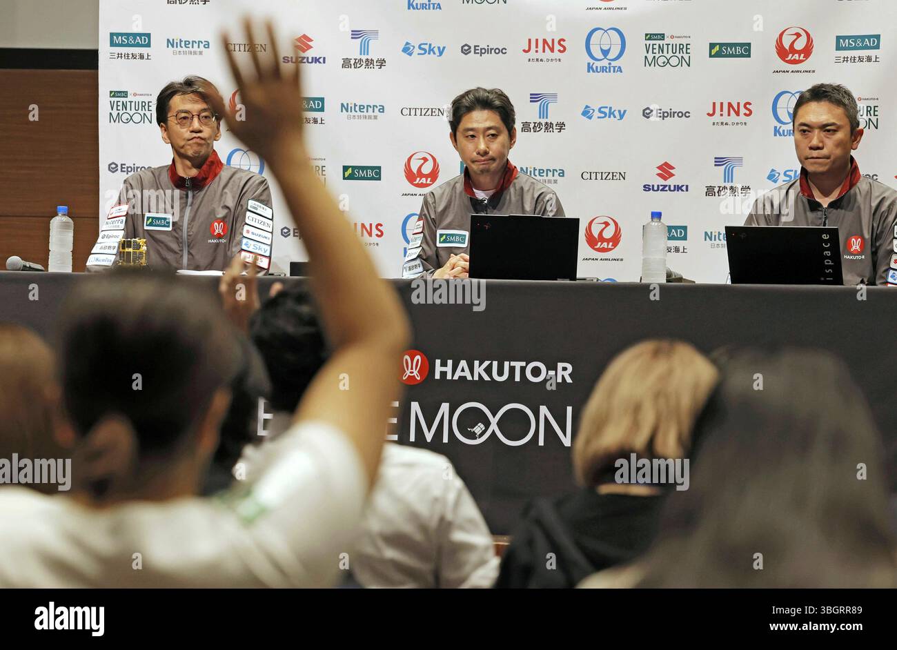 ispace CEO and founder Takeshi Hakamada, center, attends a press conference about their private ...