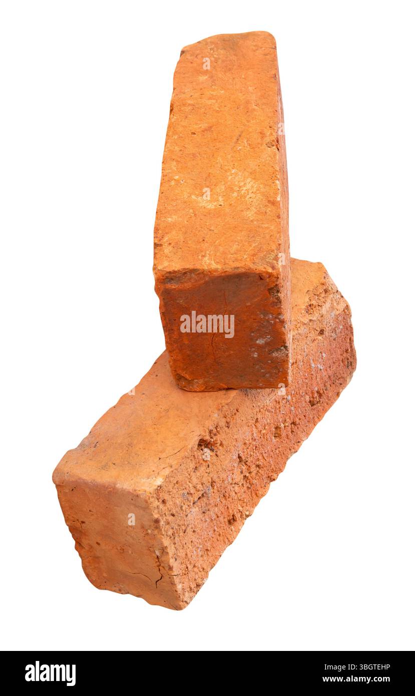 Side view of two cracked old red or orange bricks in stack is isolated ...