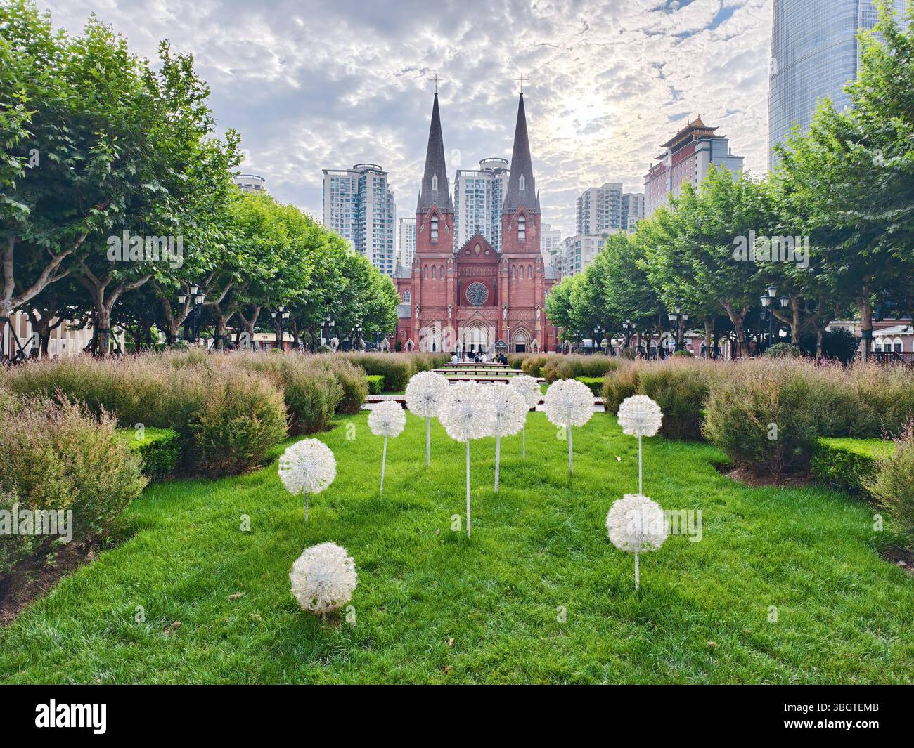 Tourists are taking a walk in Xujiahui Catholic Church Square in ...