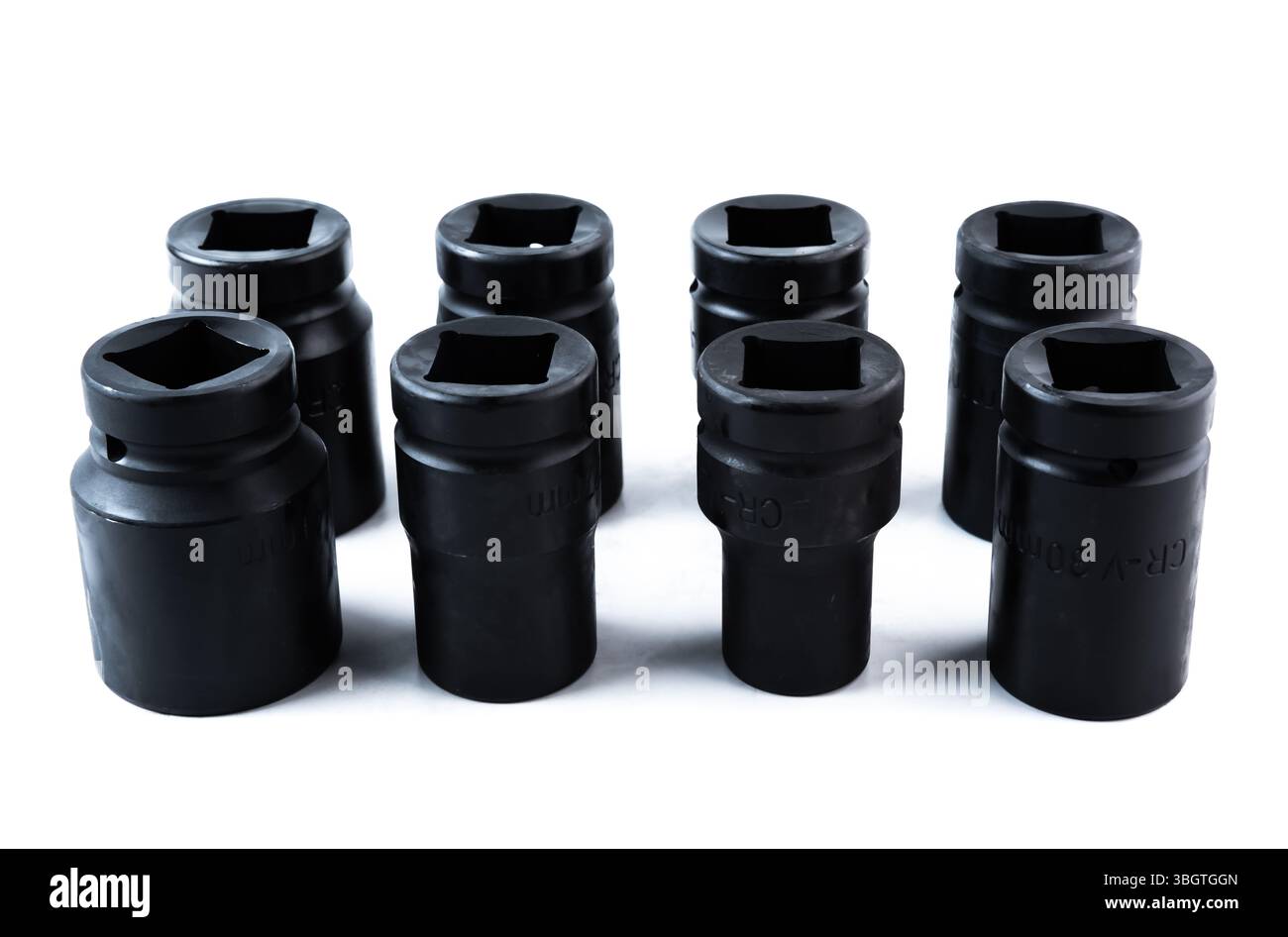 Vertical arrangement of impact sockets in assorted sizes on white ...