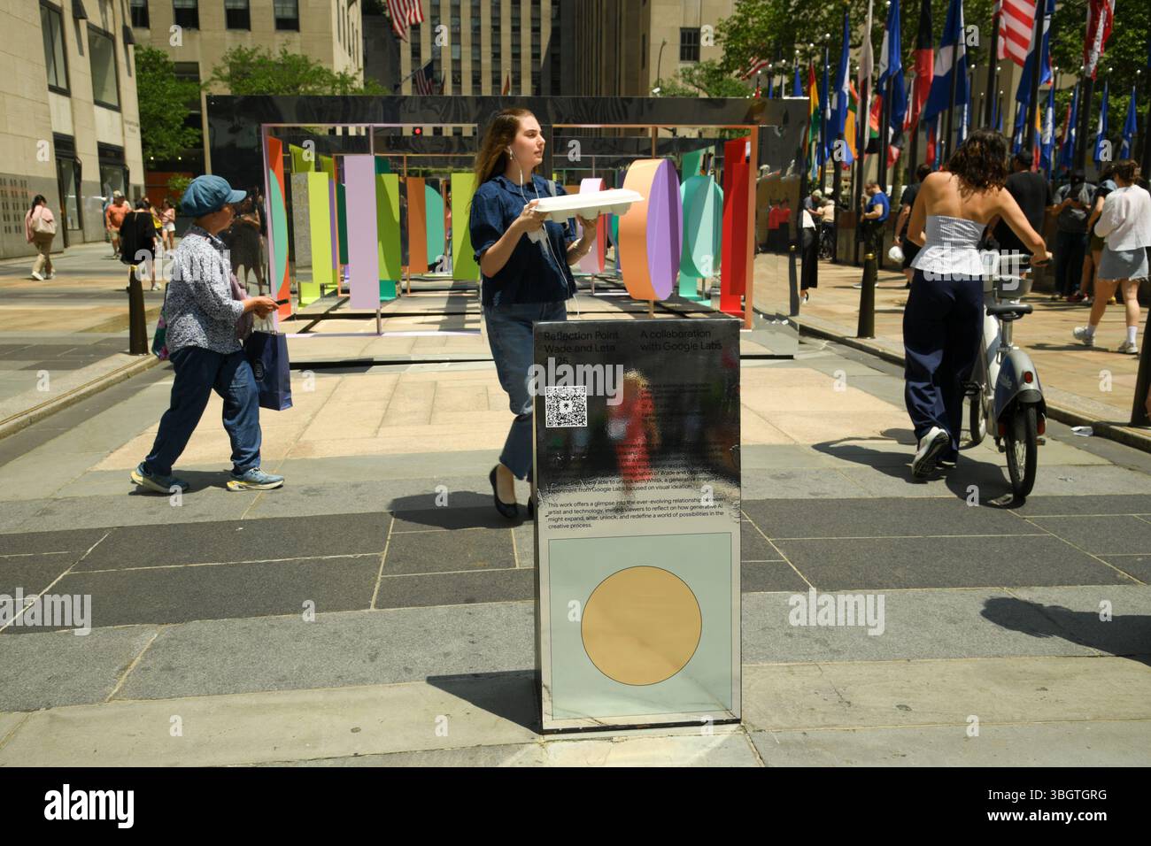 New York, USA. 05th June, 2025. People walk by "Reflection Point" by ...