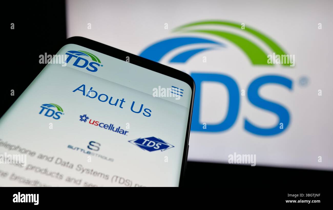 In this photo illustration, a mobile phone with the website of company ...