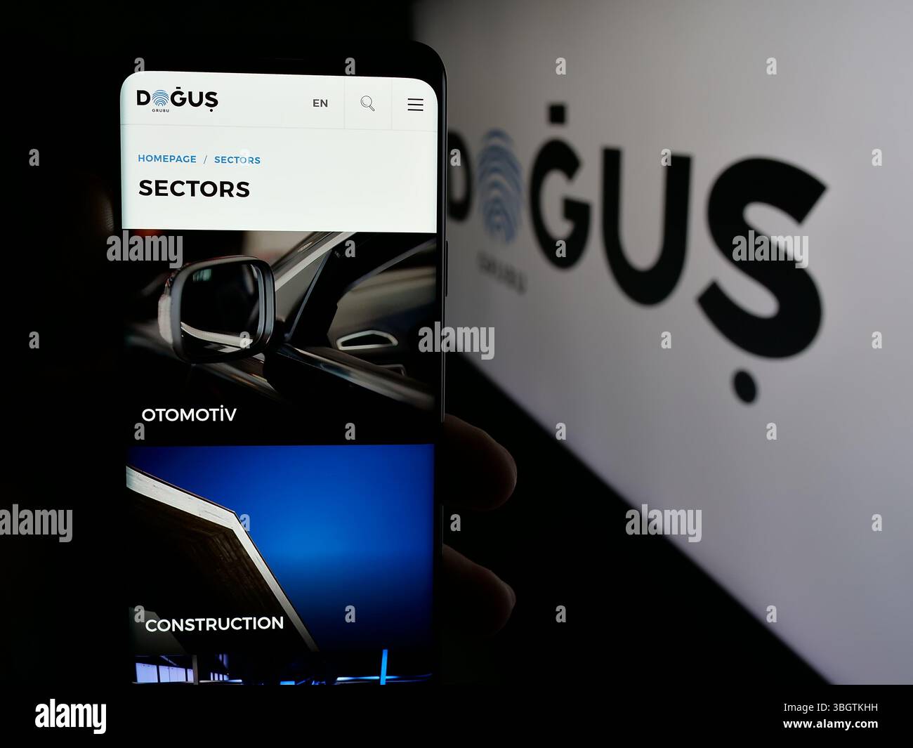 In this photo illustration, a person is holding a cellphone with the ...