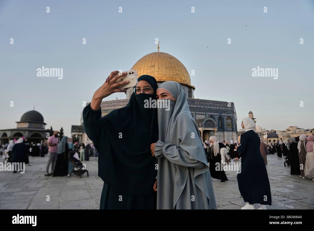 Muslim worshipers gather for Eid al-Adha prayers next to the Dome of ...