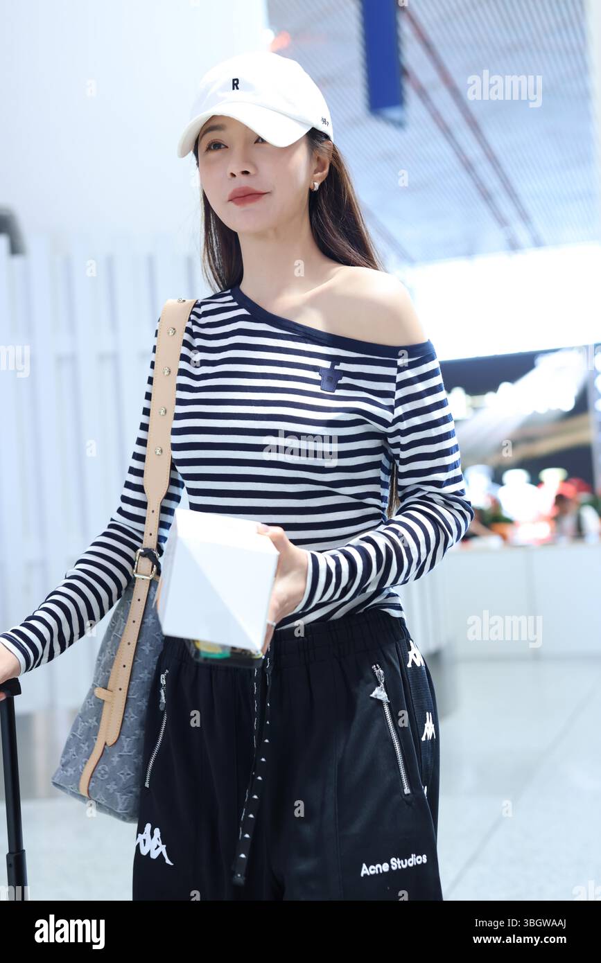 Chinese actress, host, and model Shen Mengchen appears at the airport ...