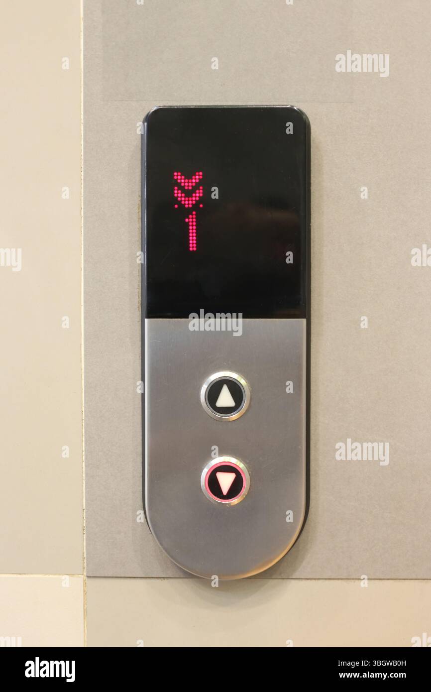 Modern elevator control panel featuring a digital display and buttons ...