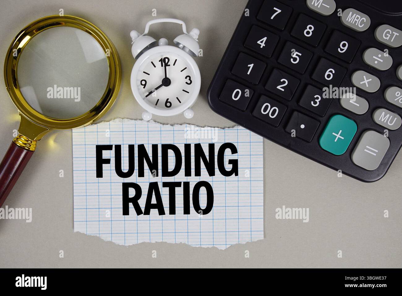 Funding Ratio text with alarm clock, magnifying glass anc calculator ...