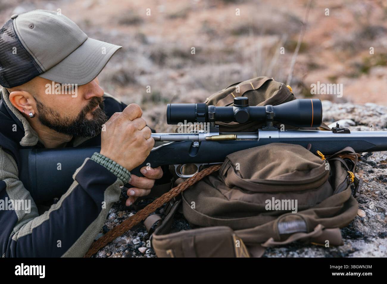 Hunter preparing bolt action rifle for hunting Stock Photo - Alamy