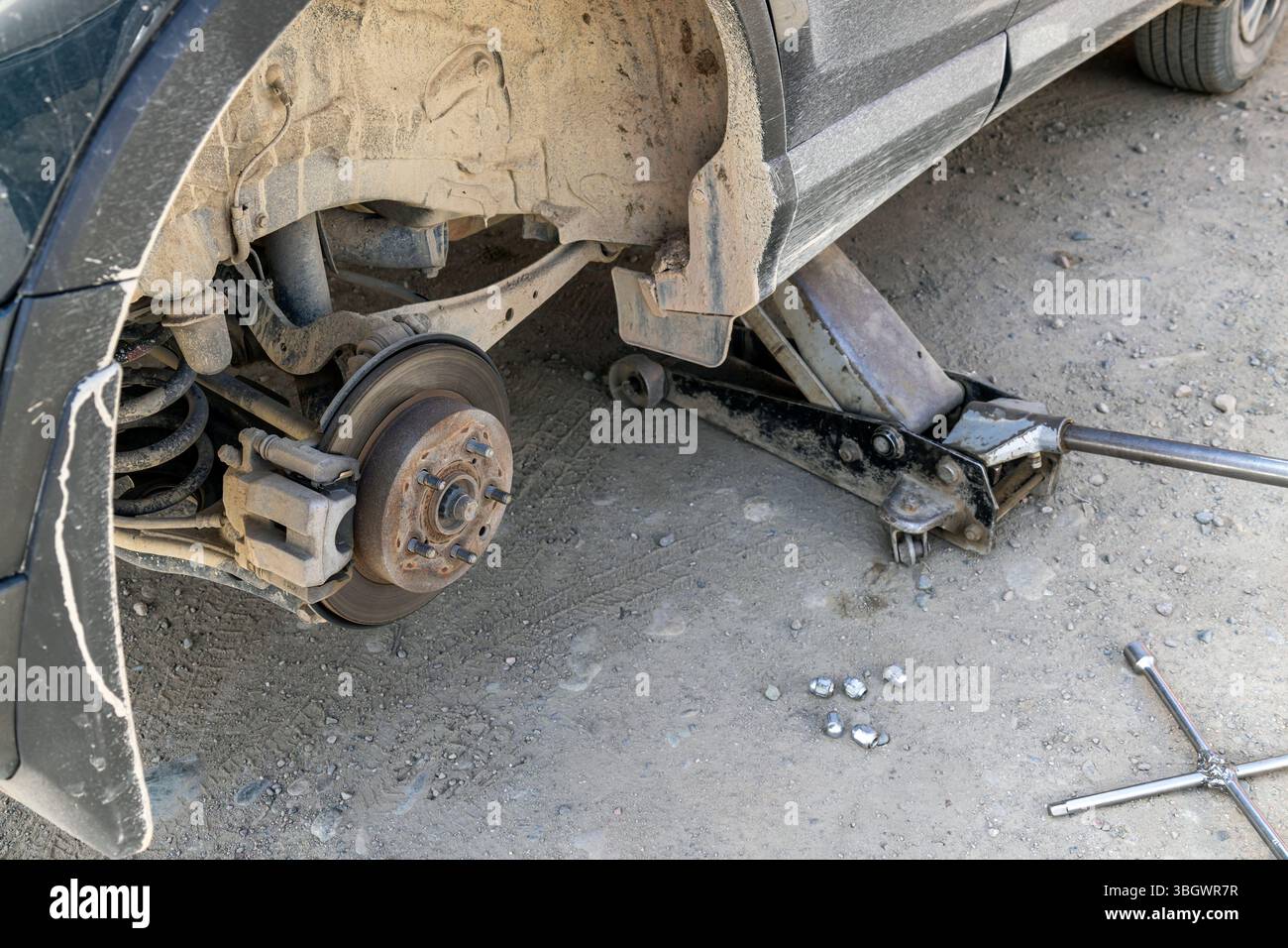 Car brake disc with caliper and wheel hub. The removed car wheel ...