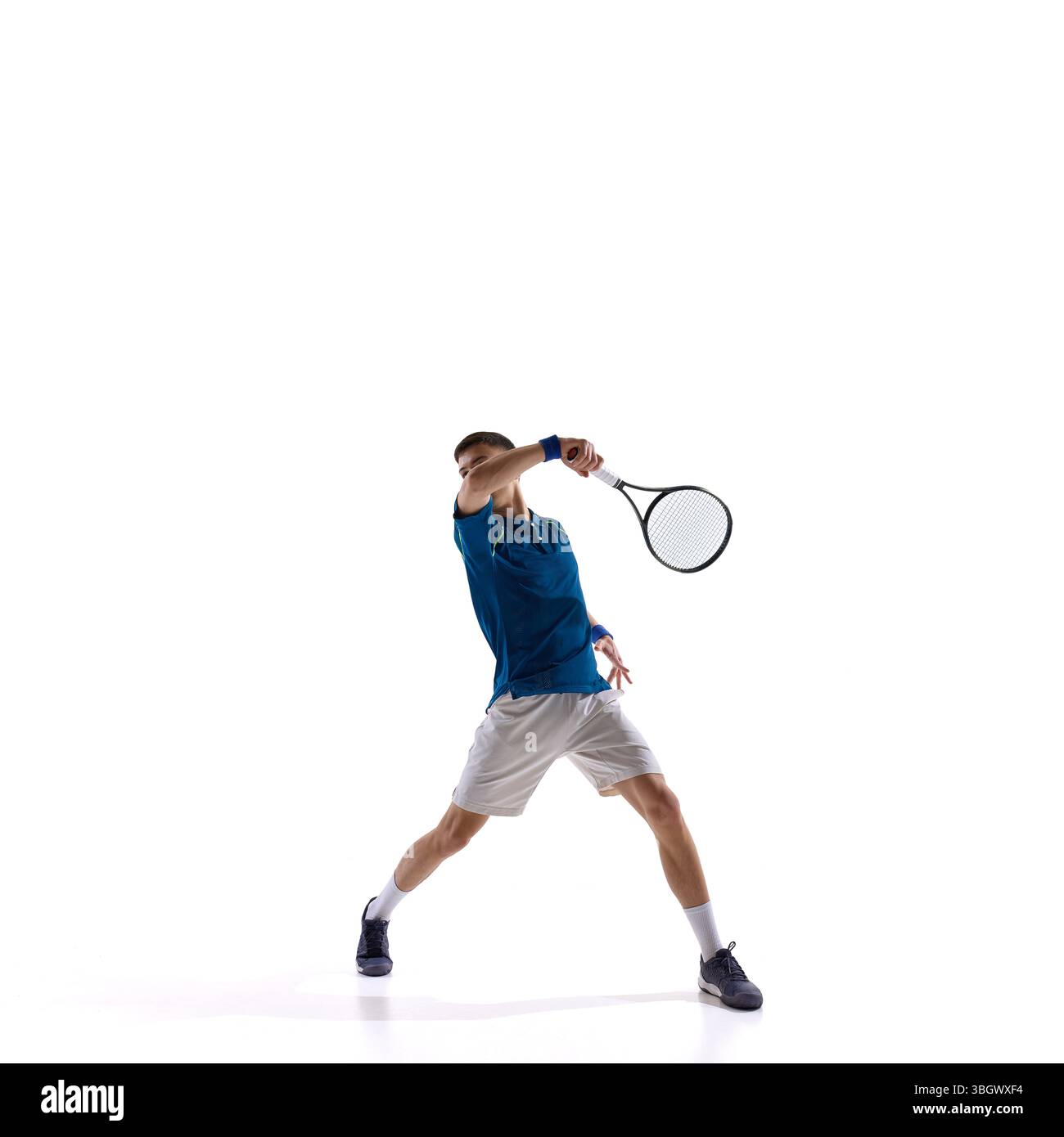 Tennis player stretching low to return fast ball, full body lunge with ...