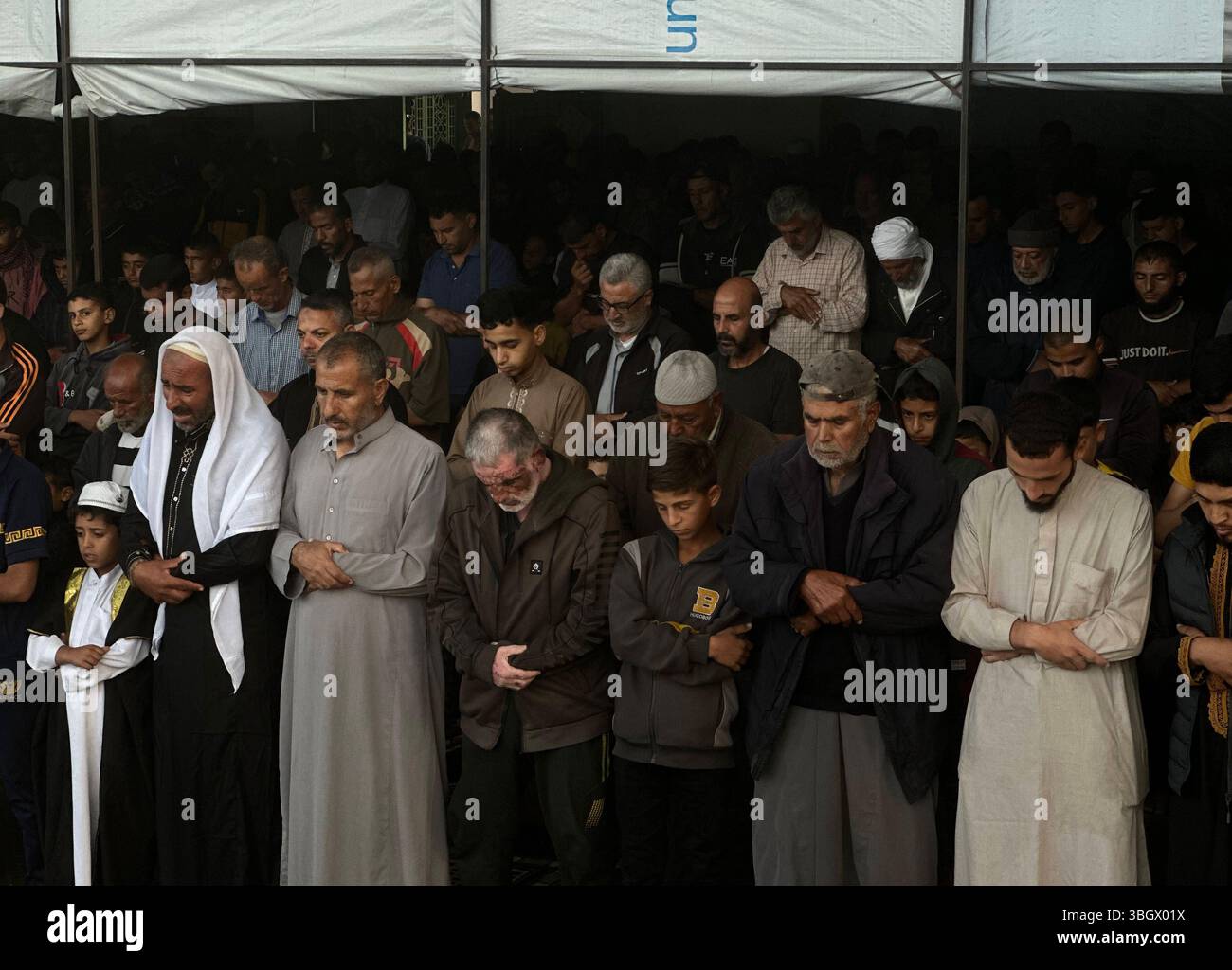 Internally displaced Palestinians attend performing Eid al-Adha prayers ...