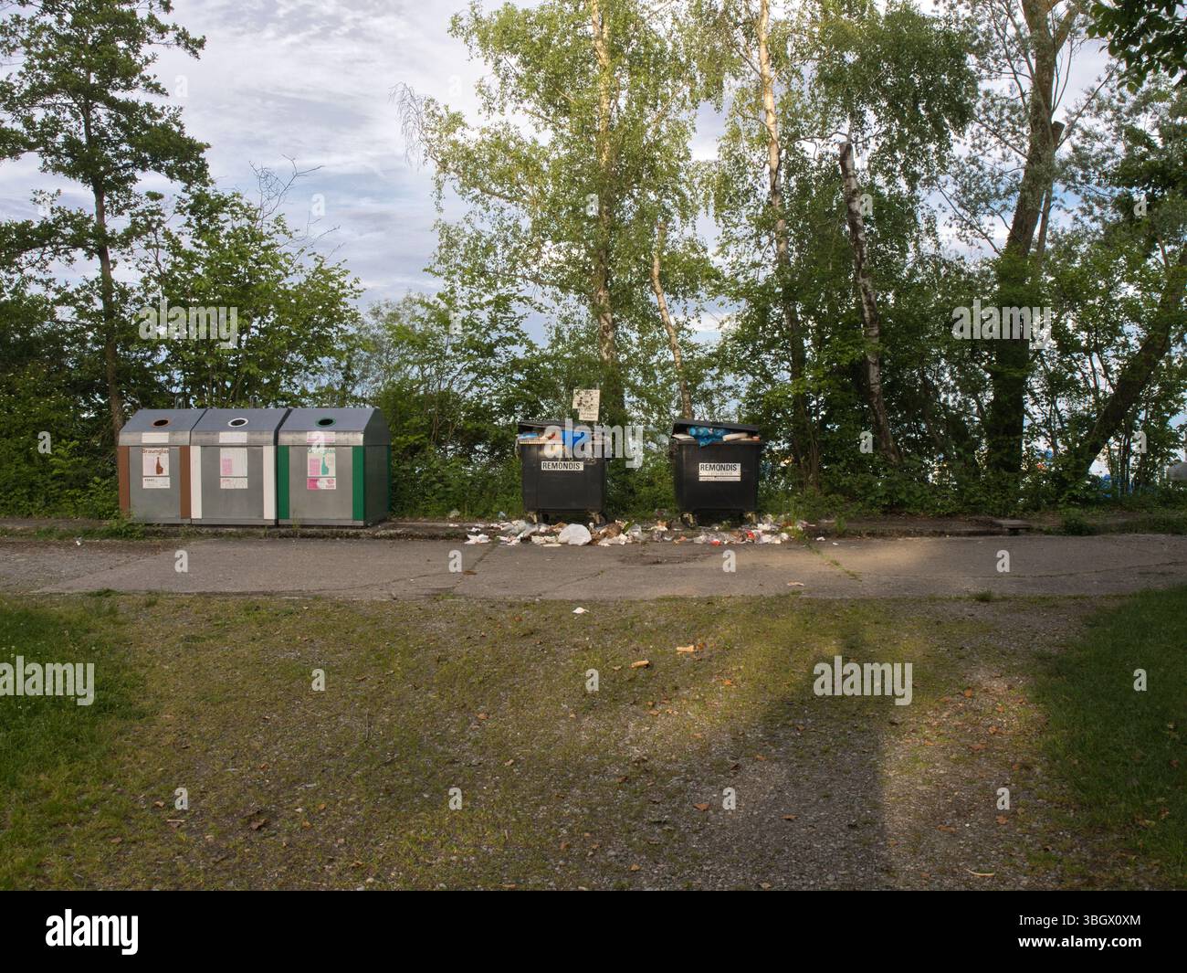 Overflowing trash bins at the entrance to a nature reserve in ...