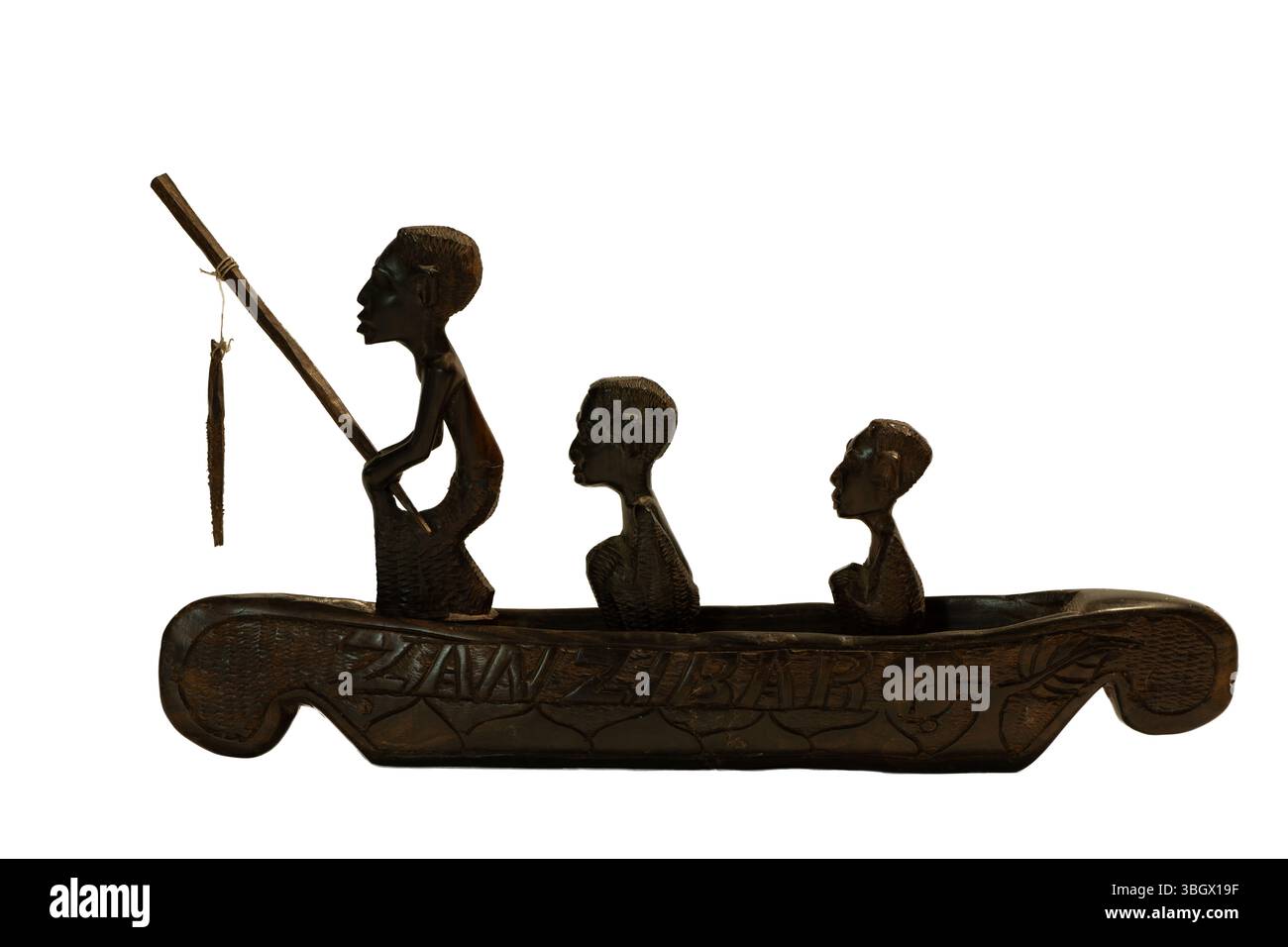 A traditional African hand-carved wooden fishing boat with three ...
