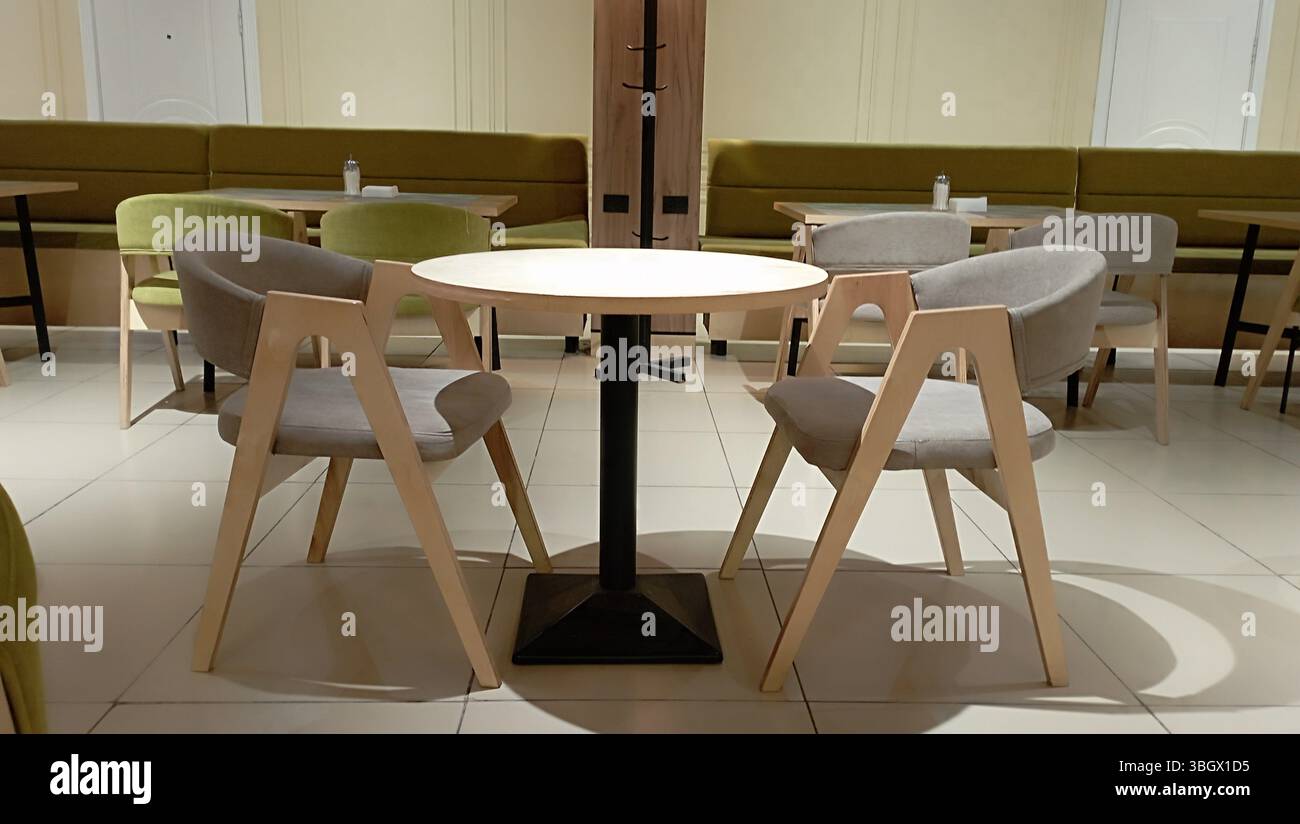 light wooden table and chairs in the interior of a modern cafe Stock ...