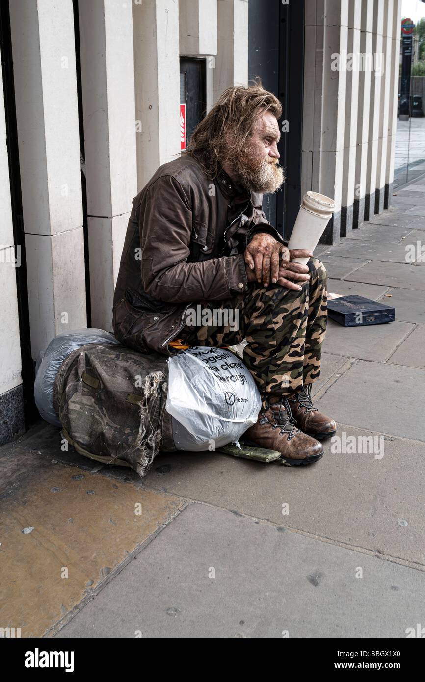 A homeless man begging for money in London in the UK in Europe Stock ...