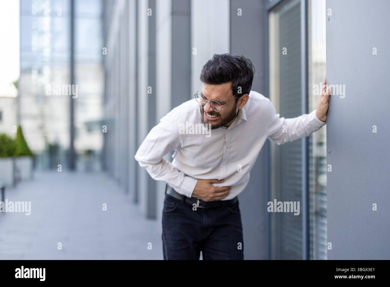 Sick asian man experiencing abdominal hi-res stock photography and ...