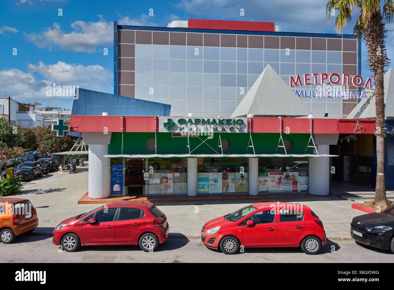 Rhodes. Greece - june 06, 2025: A pharmacy and multi-cinema in central ...