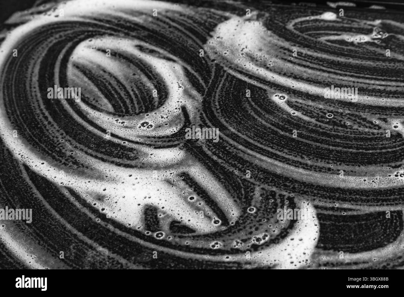 Abstract white soap curved lines on black background Stock Photo - Alamy