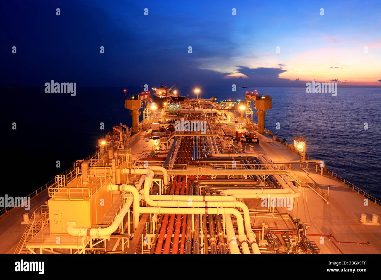 Offshore Oil And Gas Production Platform At Dusk Captured From The Deck Of A Floating