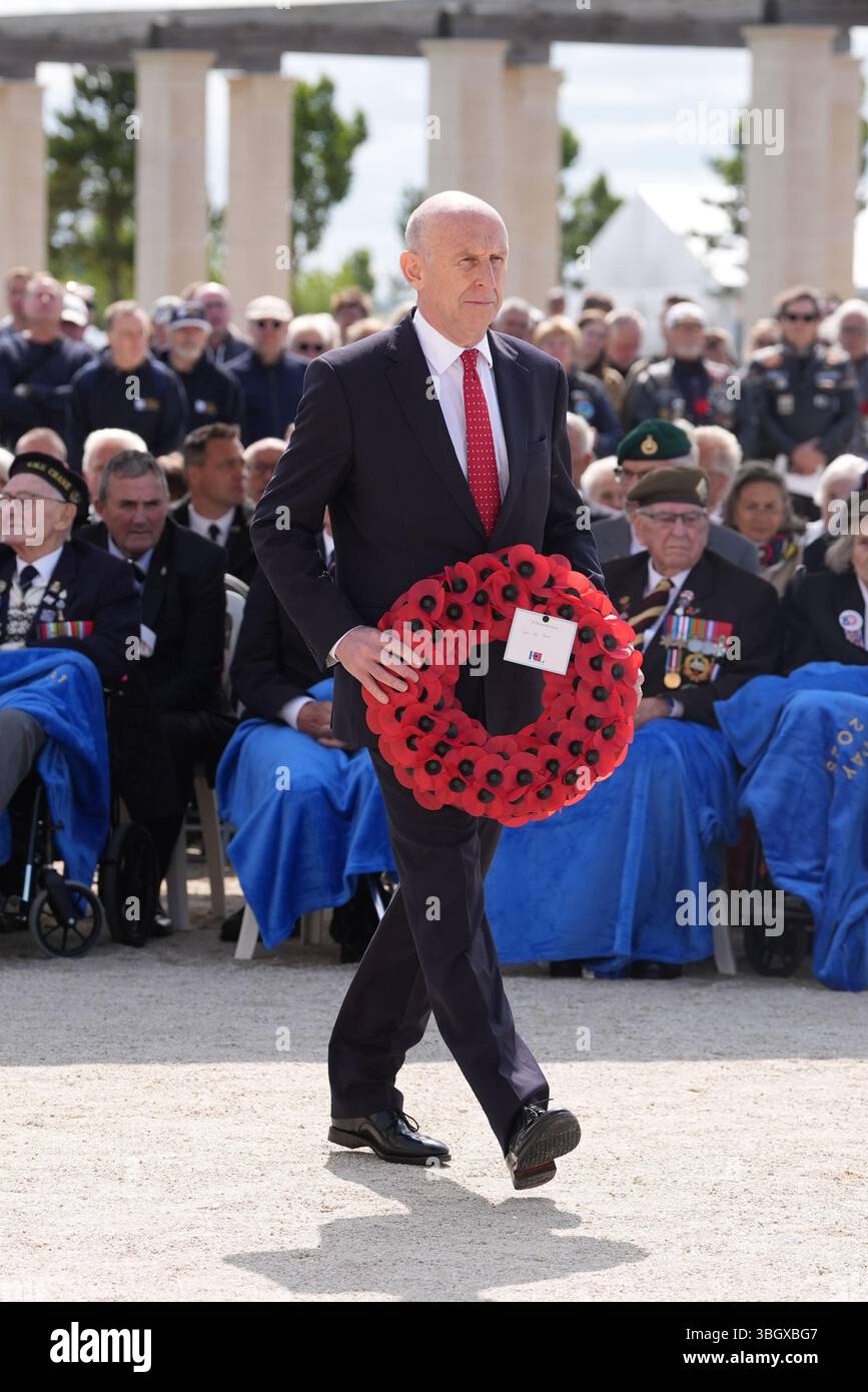 Secretary John Healey lays a wreath during a ceremony at the British ...