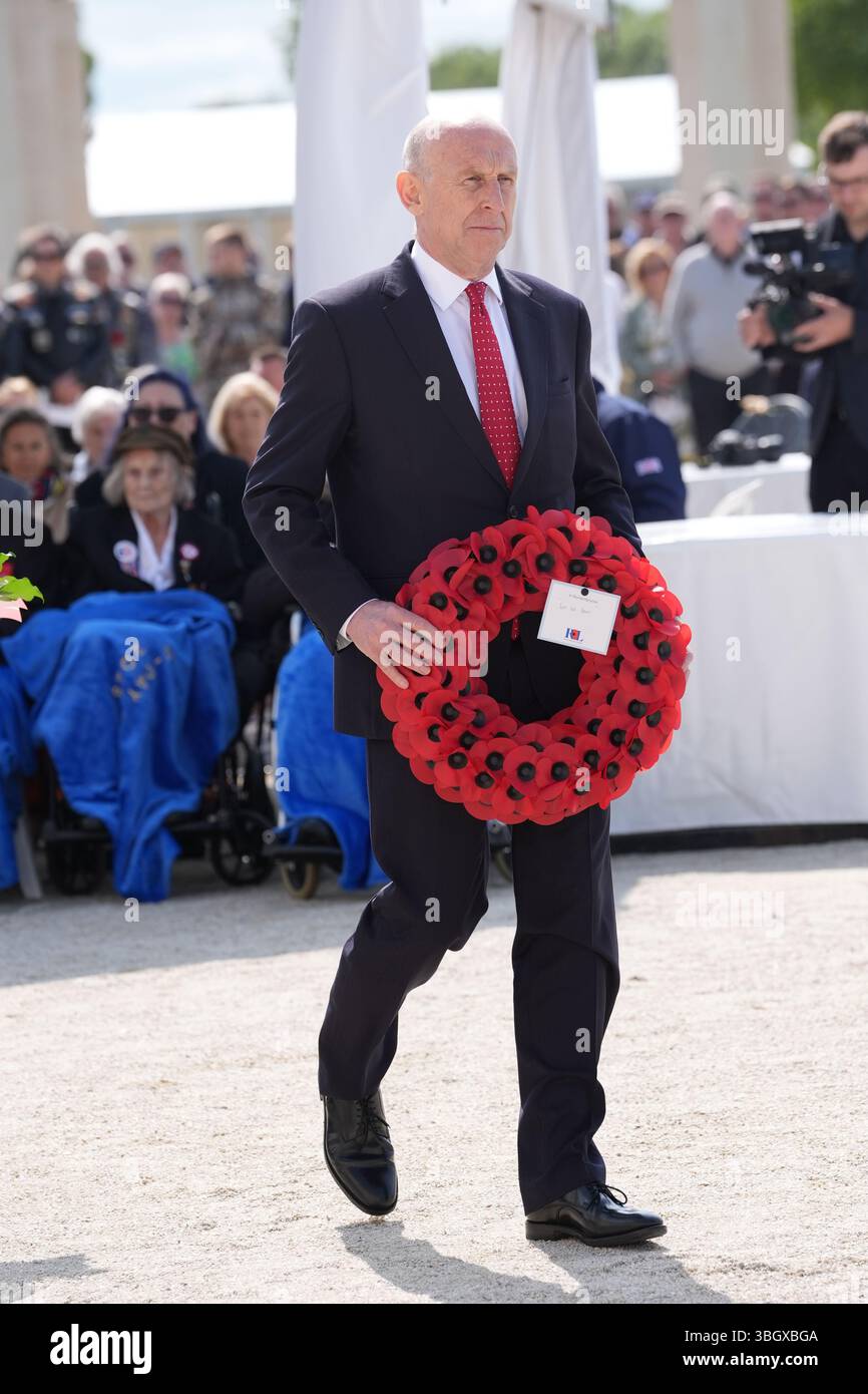Secretary John Healey lays a wreath during a ceremony at the British ...