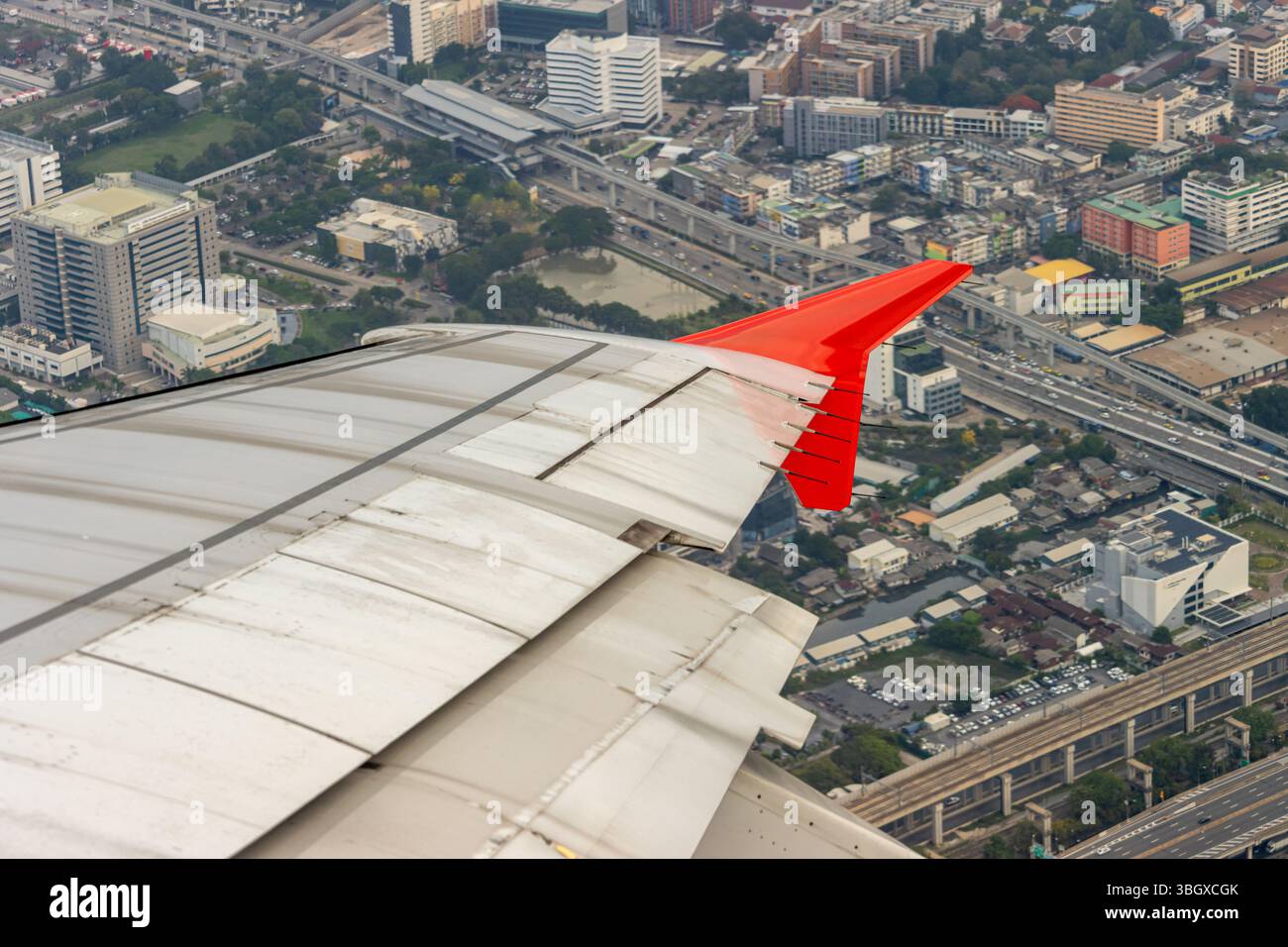 Plane maneuver above city view hi-res stock photography and images - Alamy