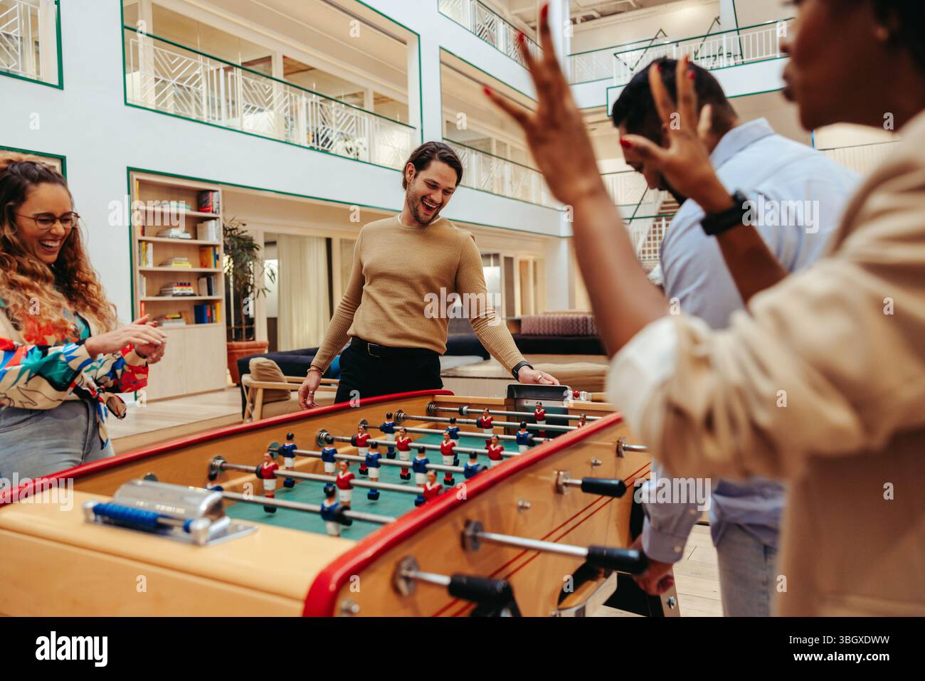 Office environment colleagues playing team hi-res stock photography and ...