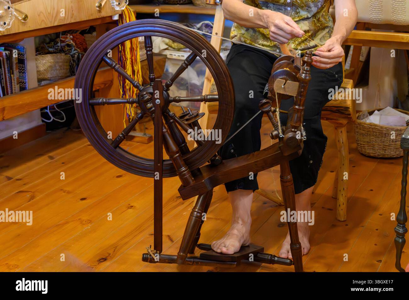 Traditional foot operated spinning wheel Photographed at Yodfat ...