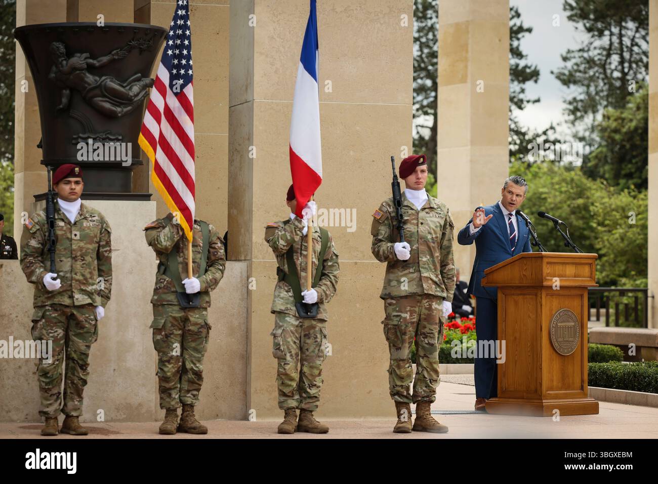 U.S. Defense Secretary Pete Hegseth, right, delivers his speech at the ...
