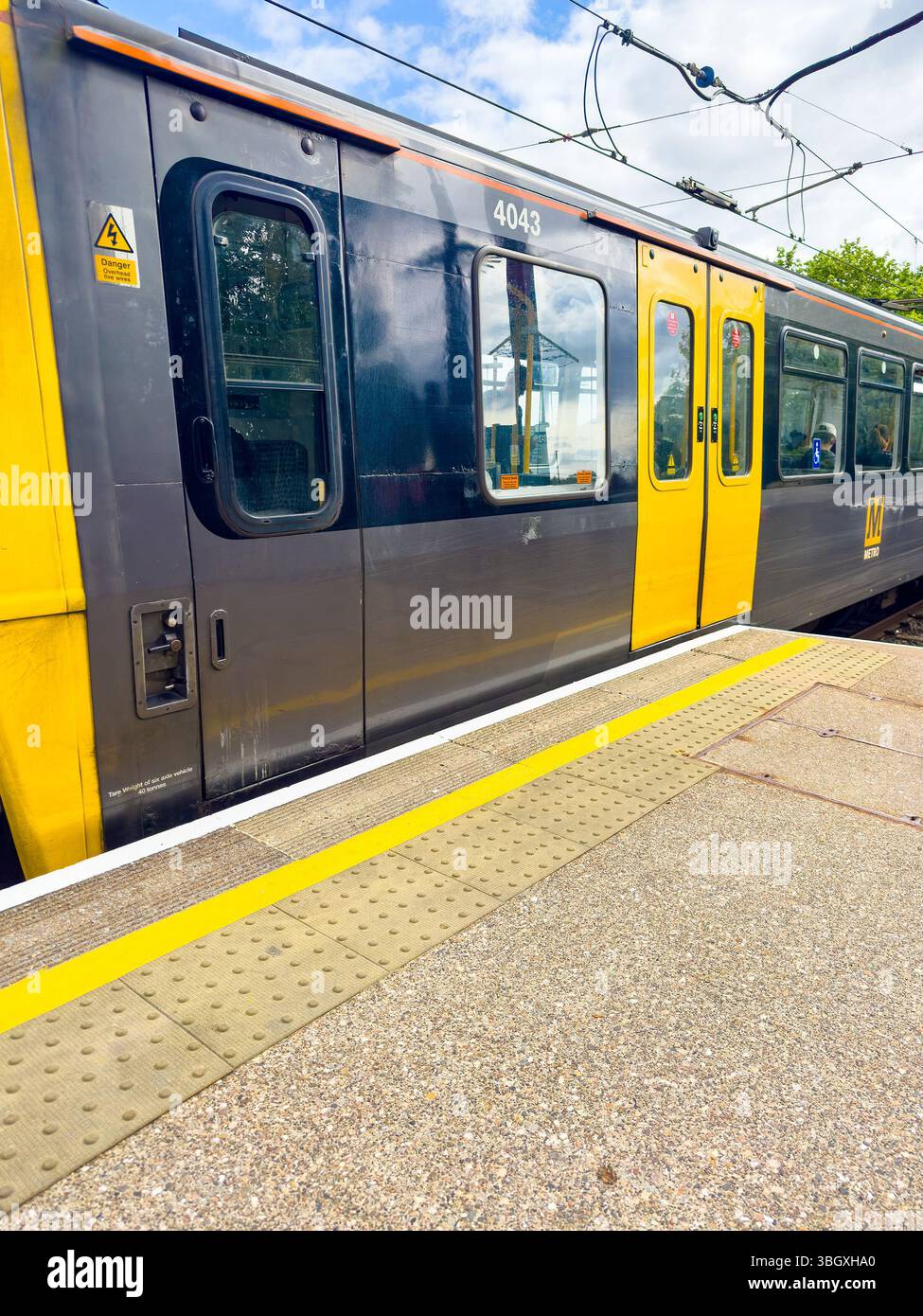 Side view of a newcastle Metro commuter train at manors station ...