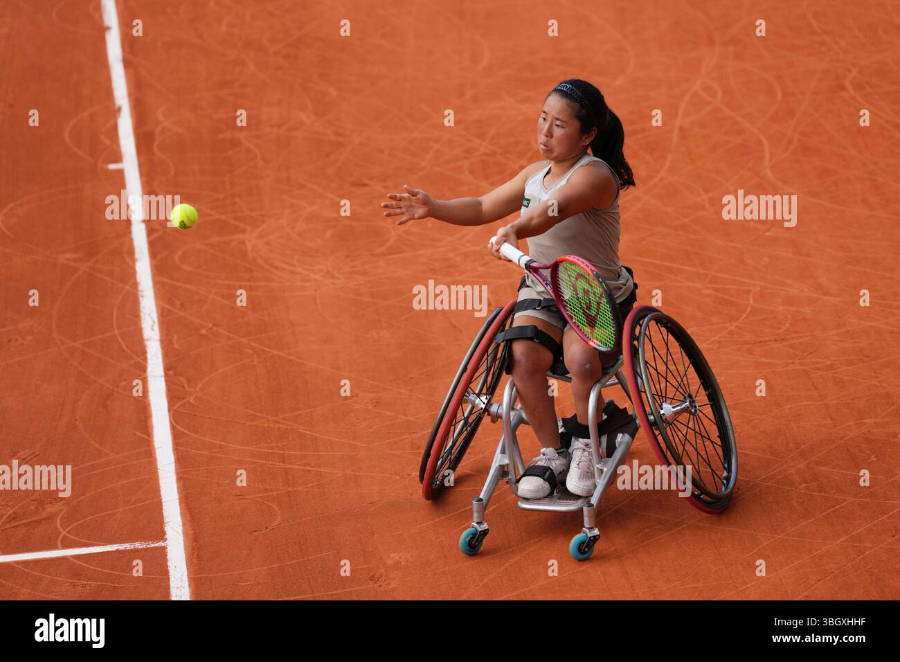 Japan's Yui Kamiji plays a shot against China's Xiaohui Li during their ...